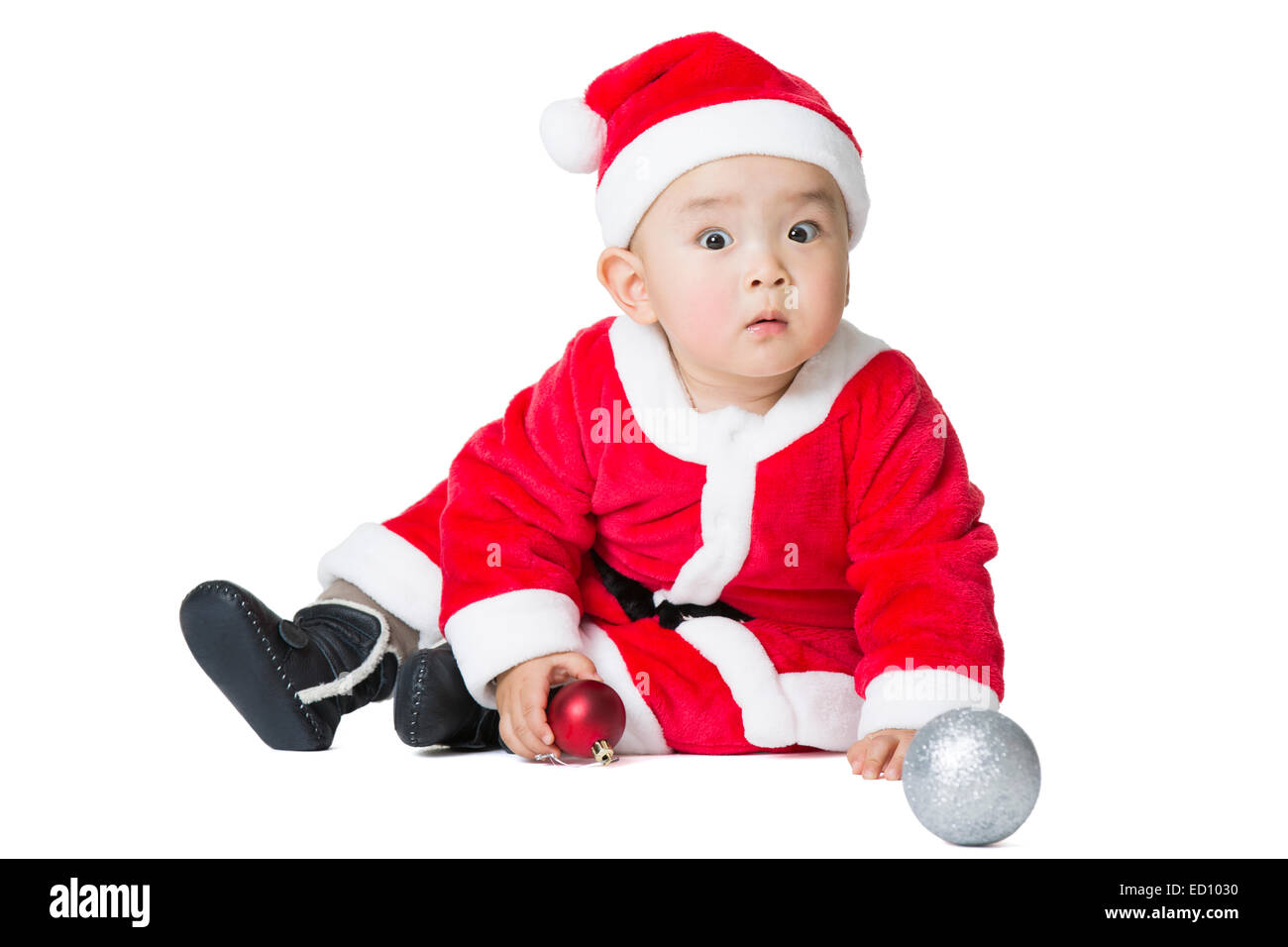 Cute baby in Santa suit Stock Photo - Alamy