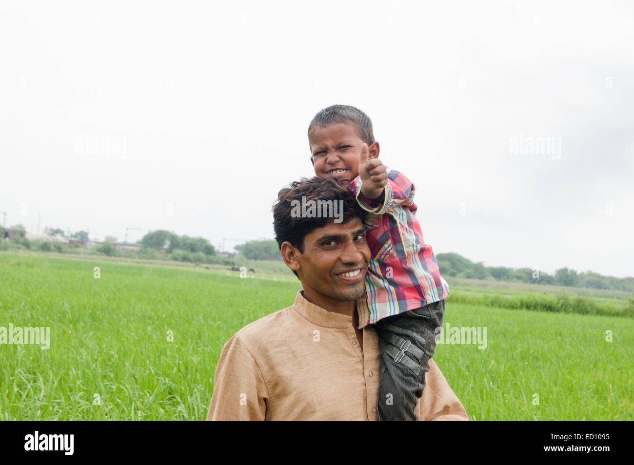 indian rural father with child field fun Stock Photo - Alamy