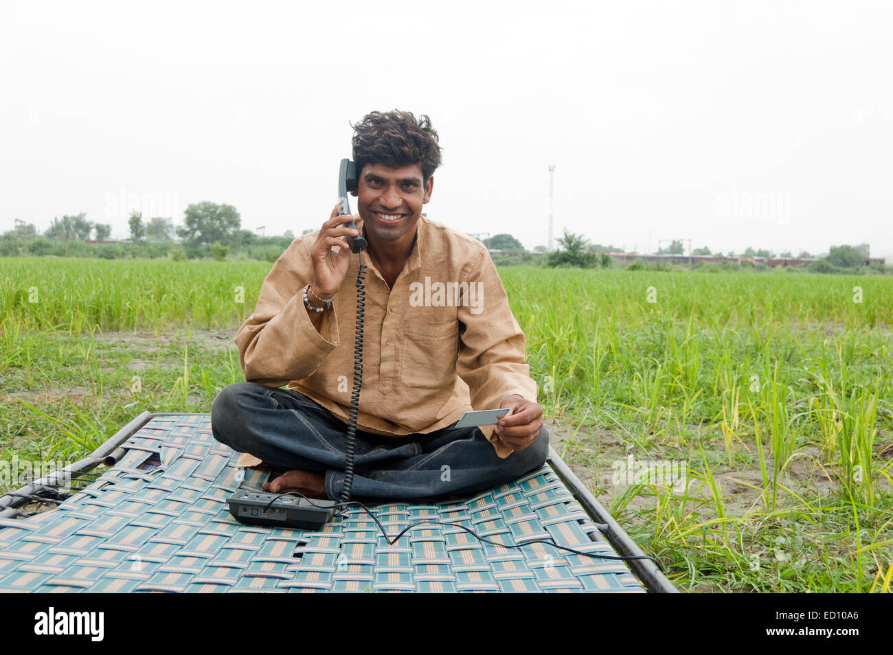 1 indian rural farmer talking phone Stock Photo - Alamy