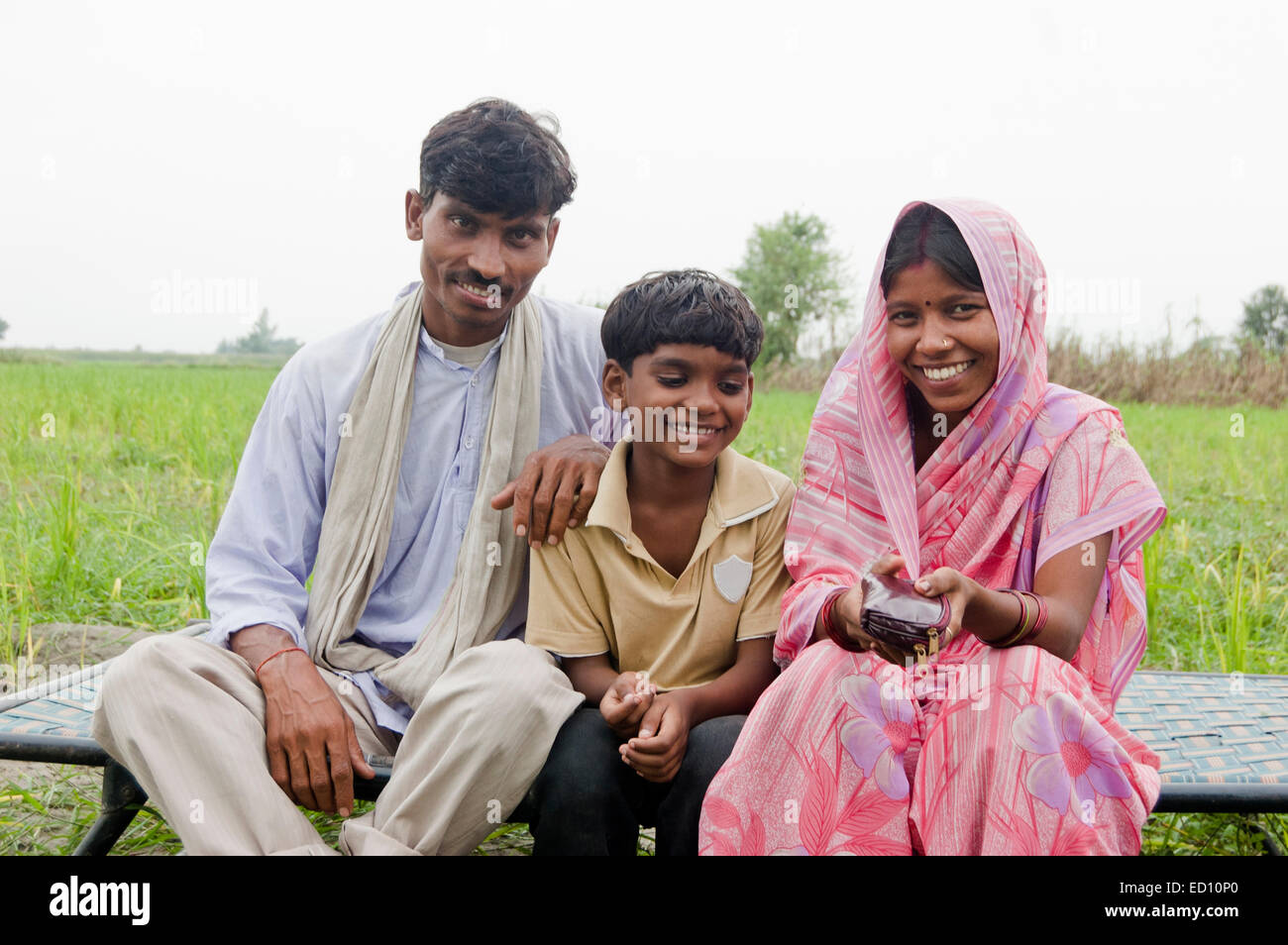 indian rural Parents and child sitting farm Stock Photo - Alamy
