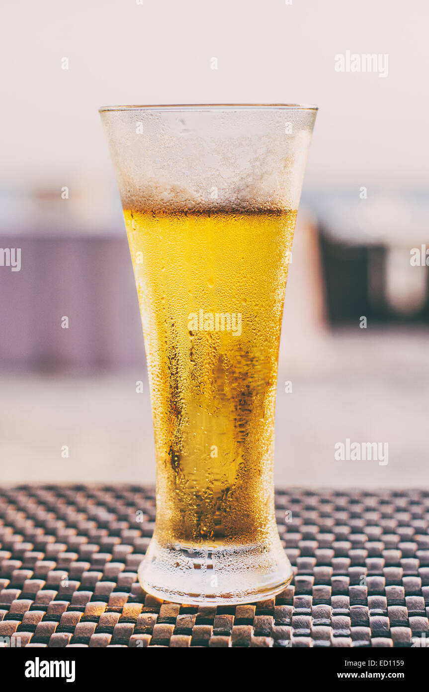 cold beer on beach, in a long glass Stock Photo - Alamy