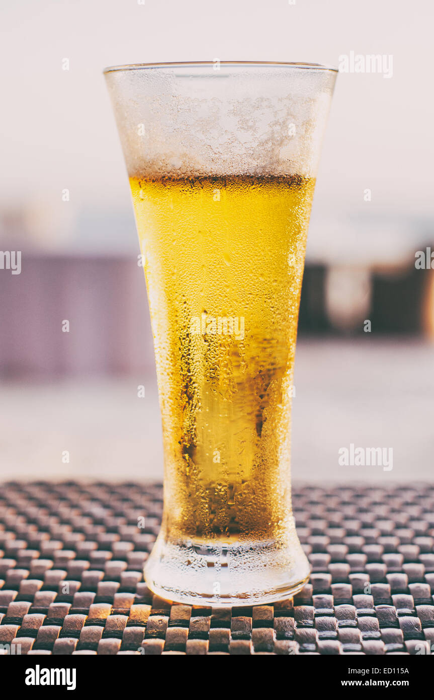 cold beer on beach, in a long glass Stock Photo - Alamy