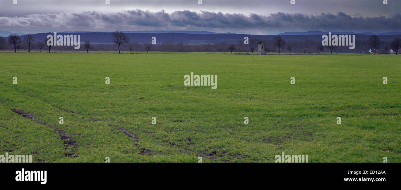 lonely tower in dramatic sky and mountain landscape Stock Photo - Alamy