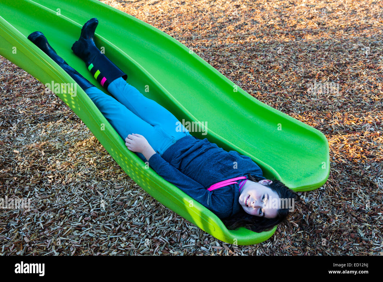 Girl playing playground upside down hi-res stock photography and images ...