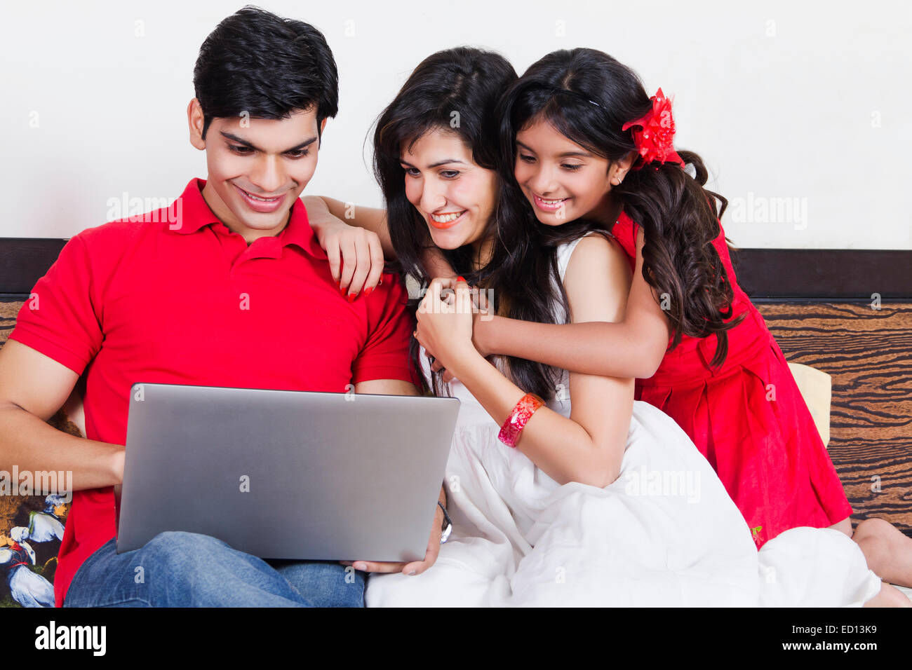 indian Parents with children home laptop chatting Stock Photo - Alamy
