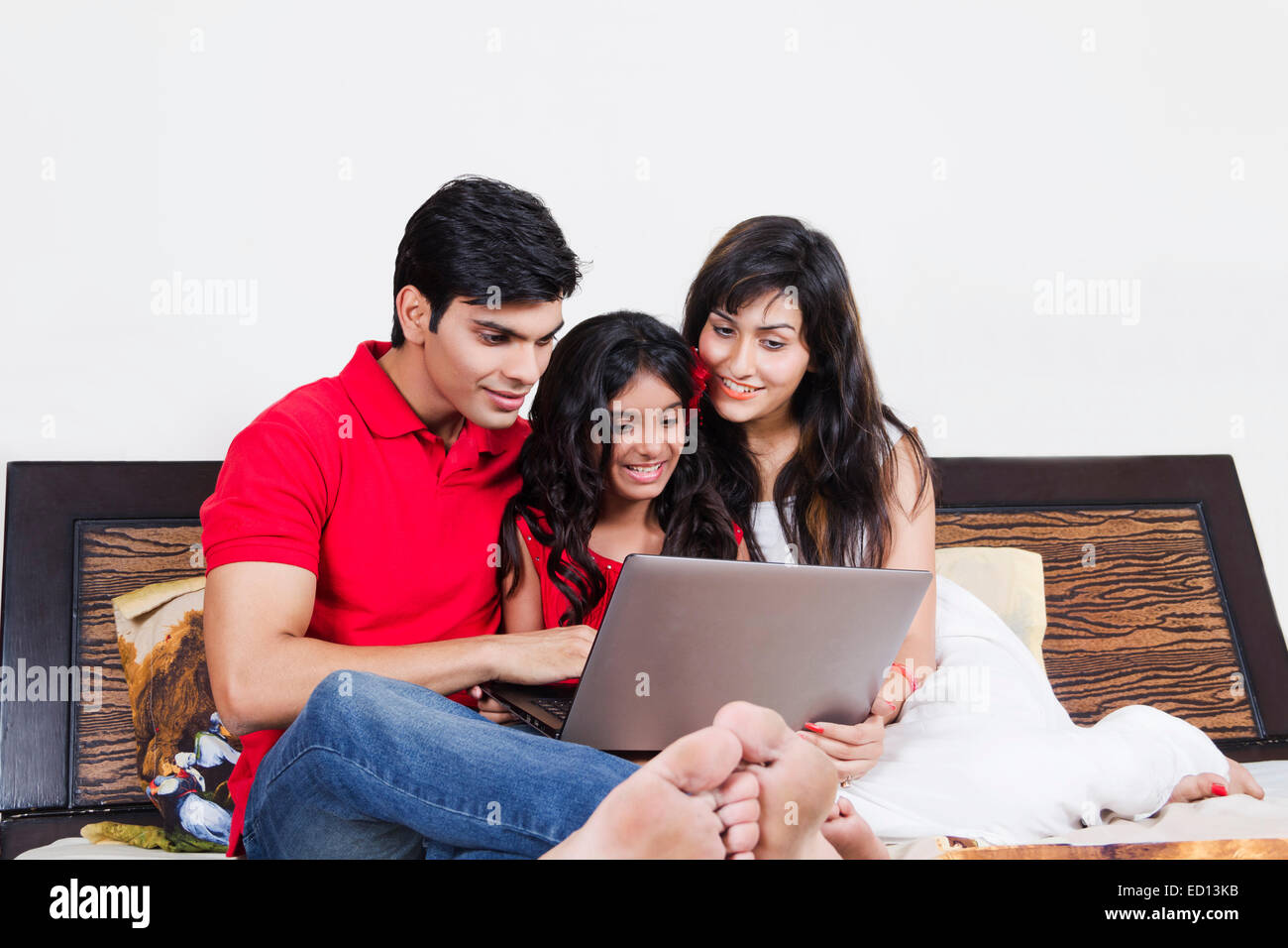 Indian parents children home laptop hi-res stock photography and images ...