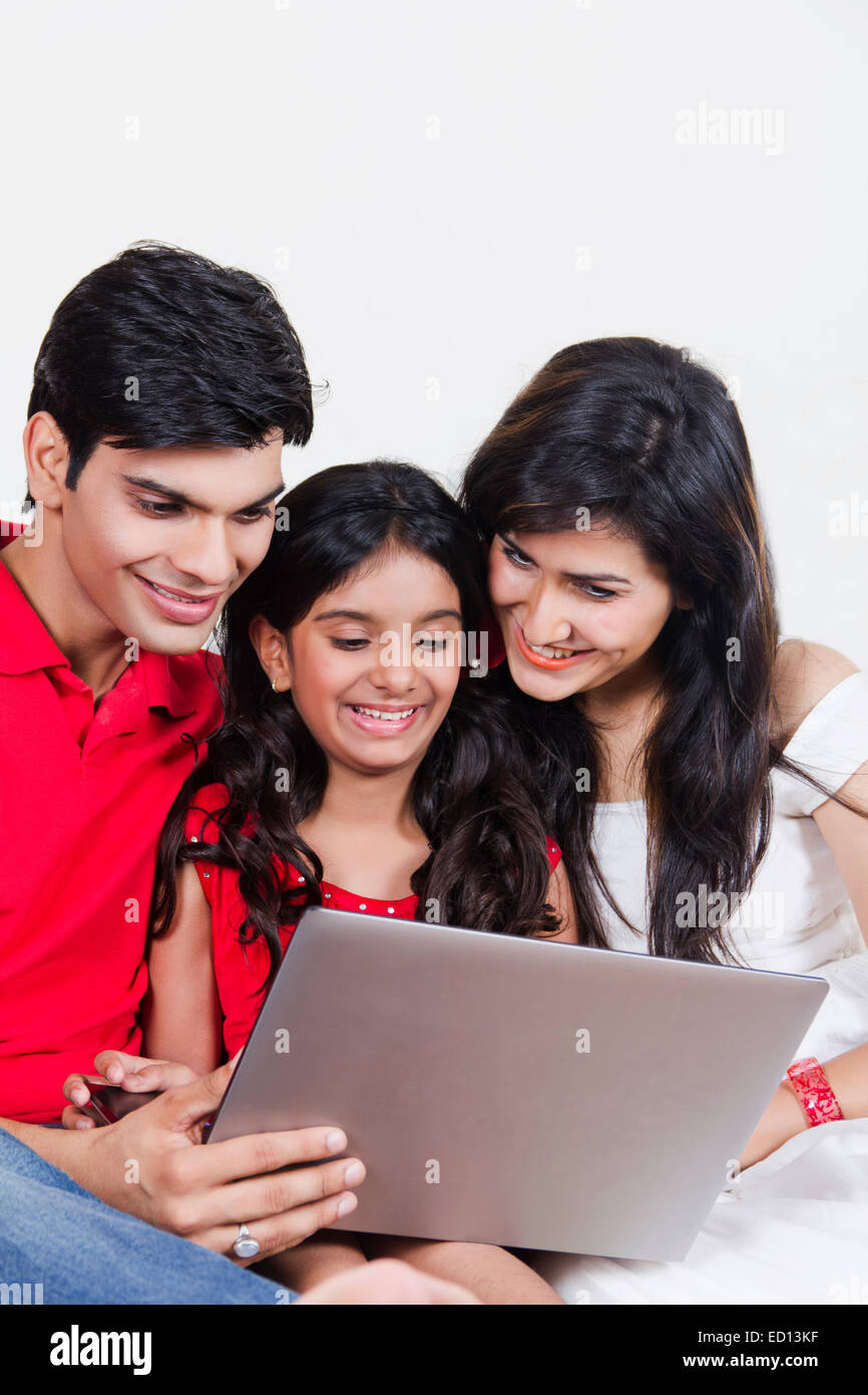indian Parents with children home laptop chatting Stock Photo - Alamy