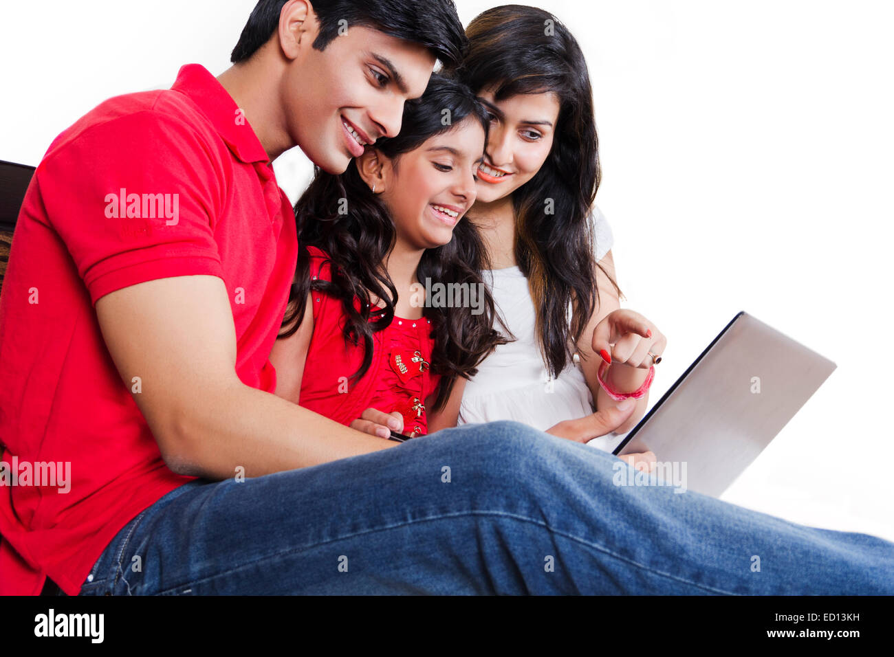 indian Parents with children home laptop chatting Stock Photo - Alamy