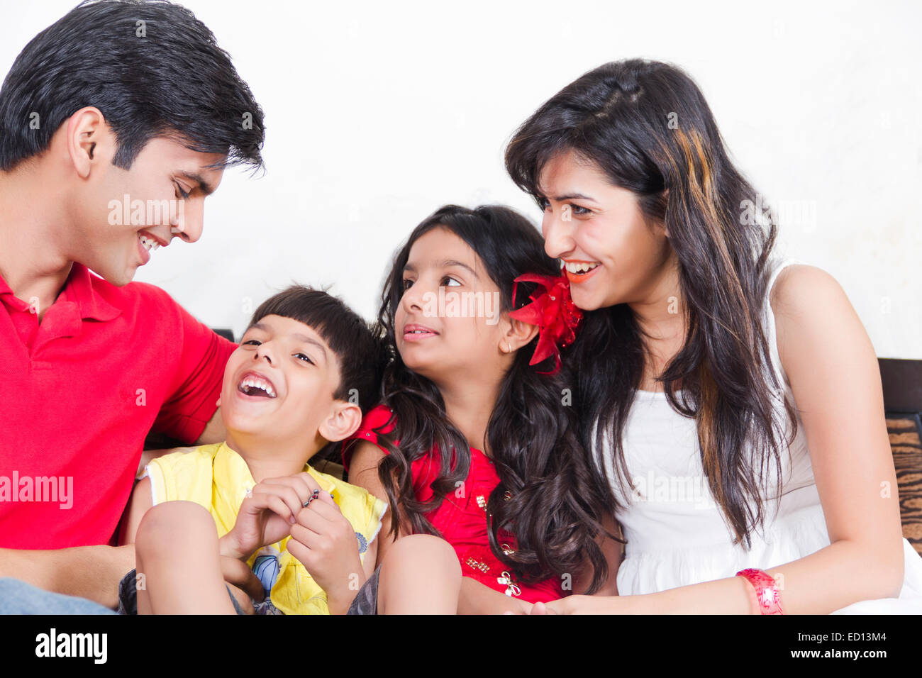 indian Parents with children home fun Stock Photo - Alamy