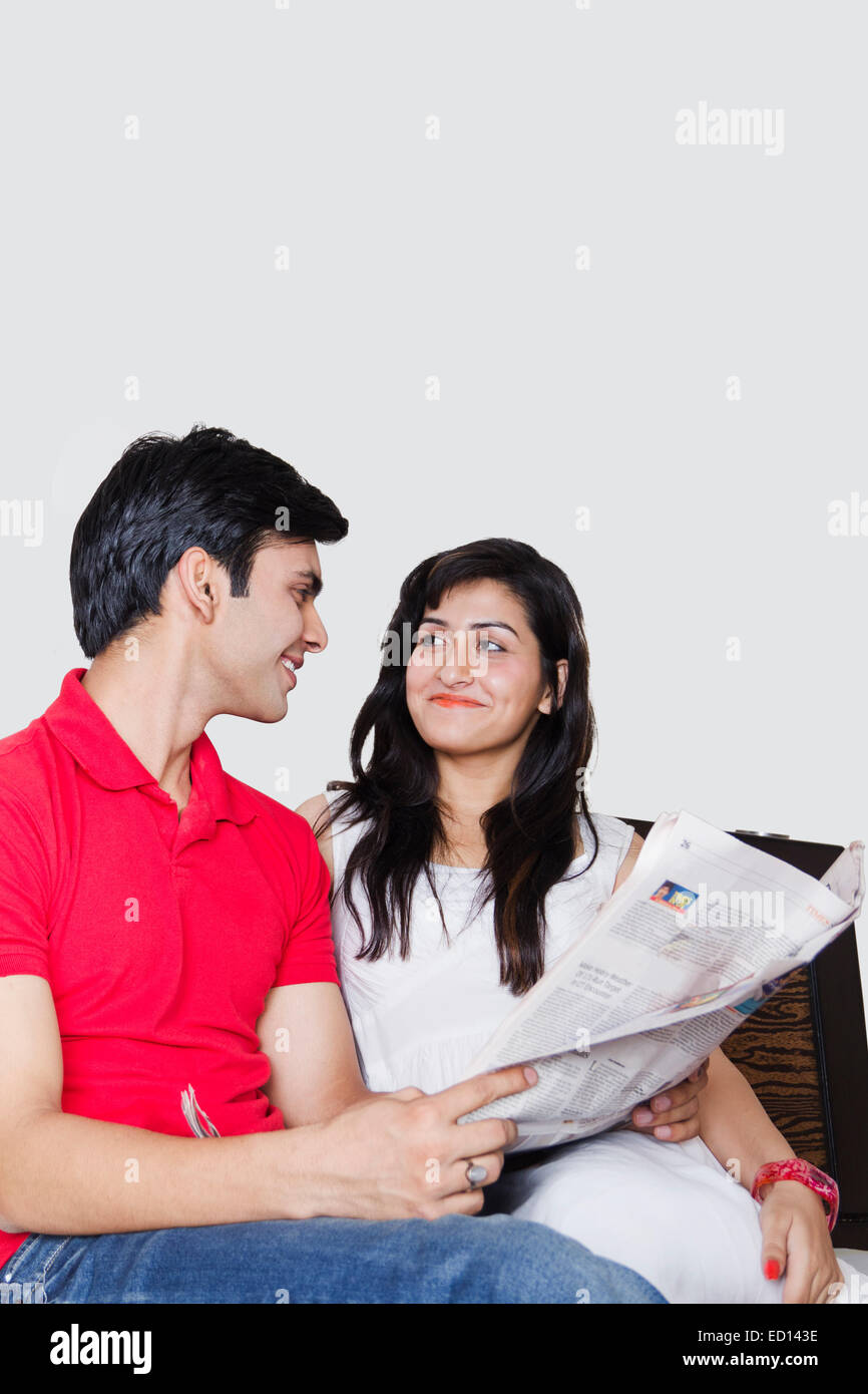 Two people read newspaper hi-res stock photography and images - Alamy