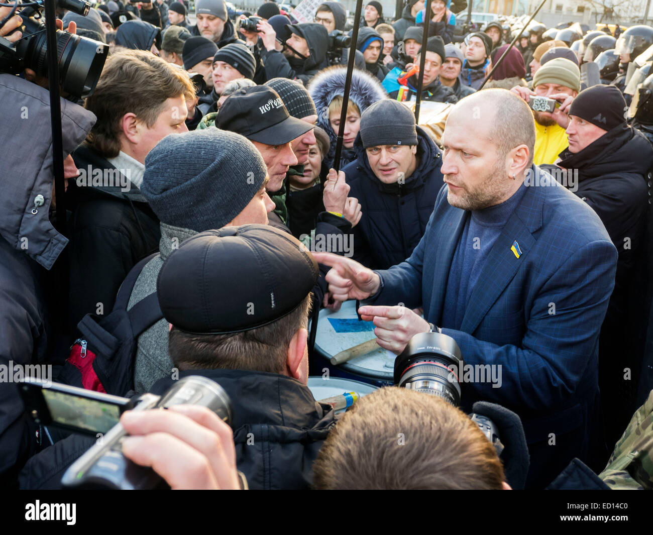Kiev, Ukraine. 23rd Dec, 2014. Deputy Borislav Bereza tries to calm ...