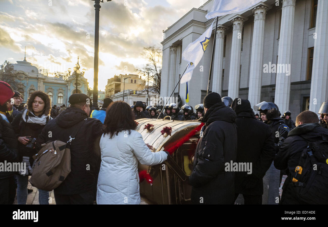Dec. 23, 2014 - Protesters have painted garbage can gold paint and ...