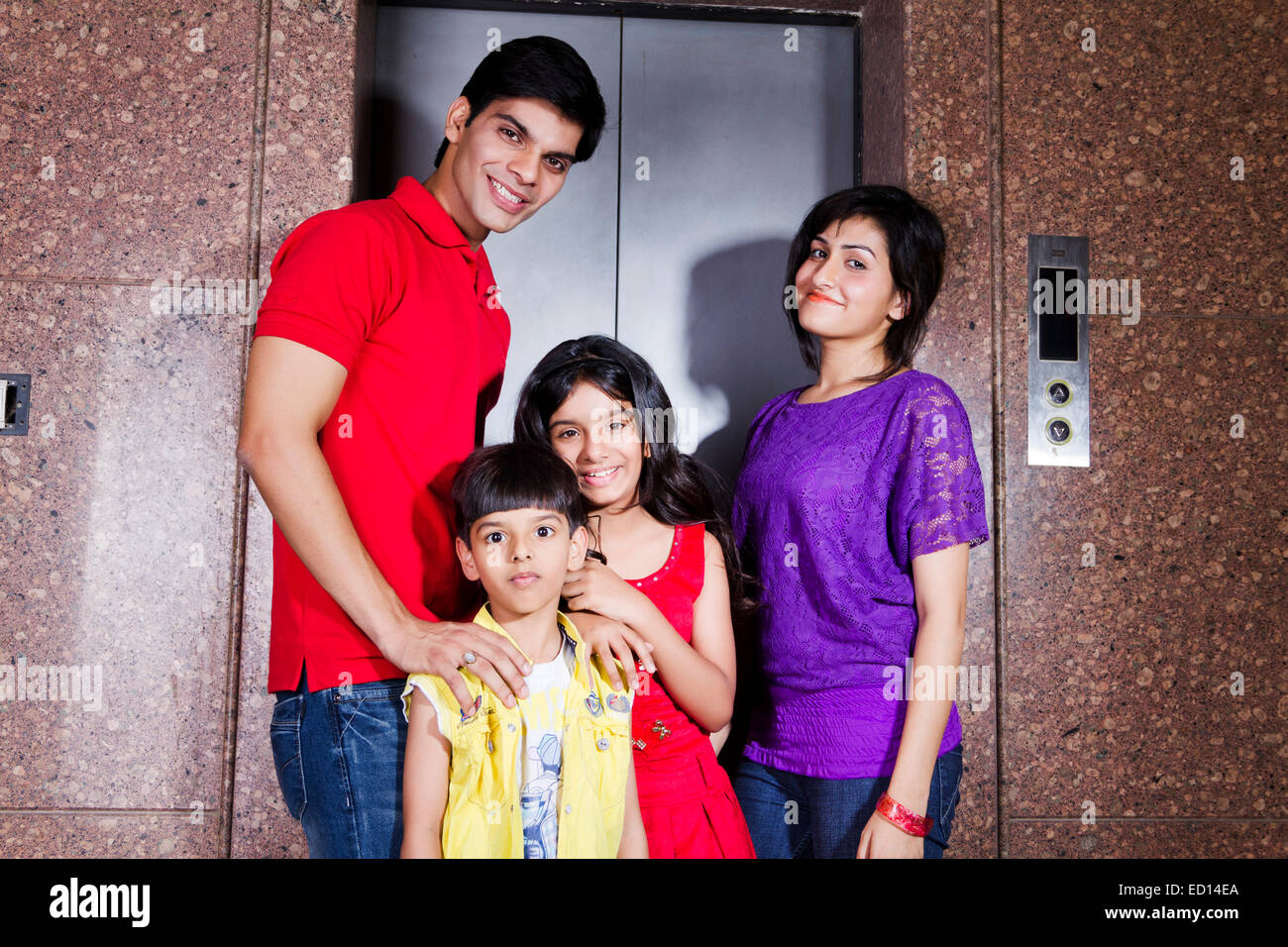 indian Parents with children standing Lift Stock Photo - Alamy