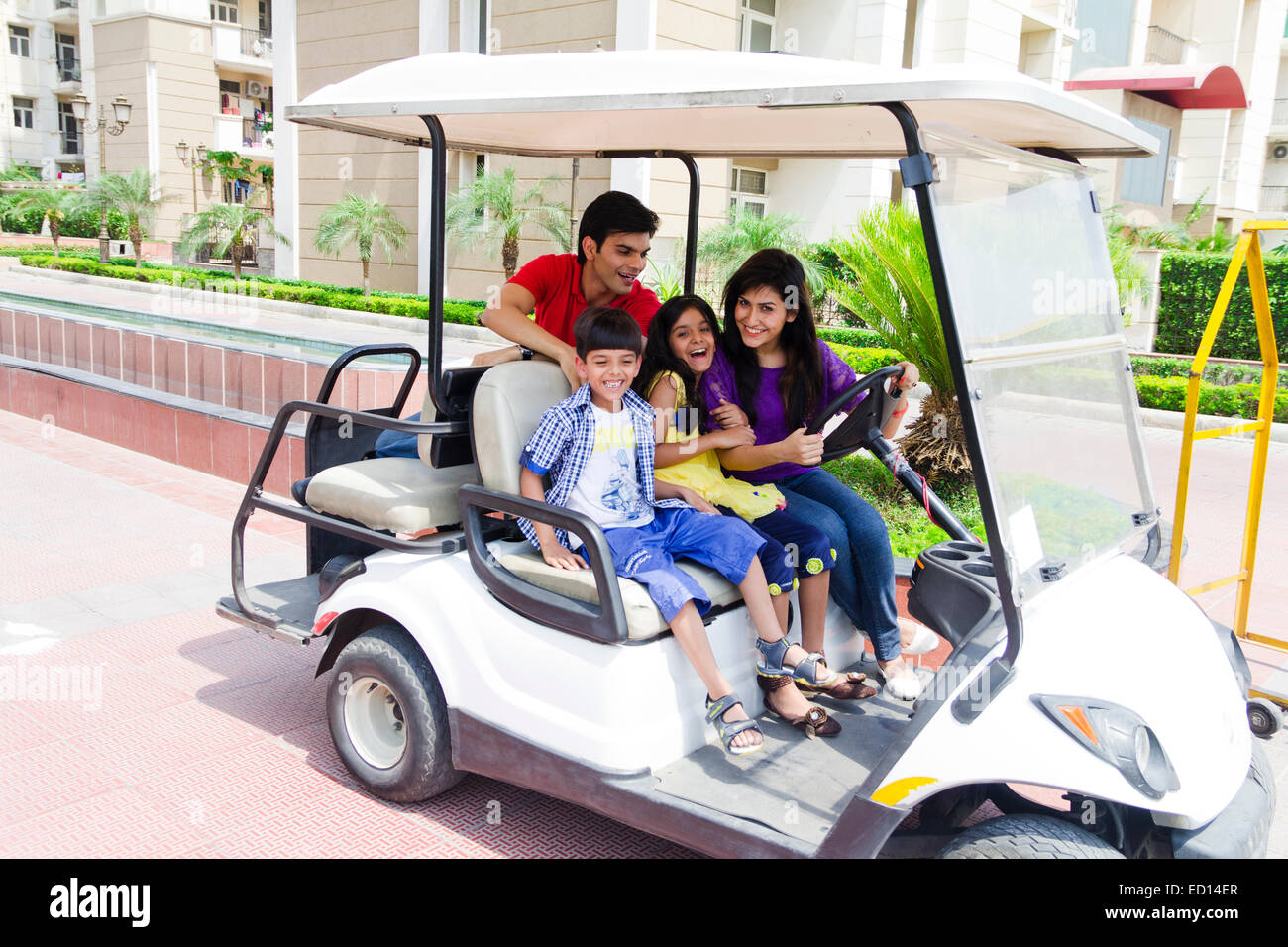 indian Parents with children park cart Riding Stock Photo - Alamy