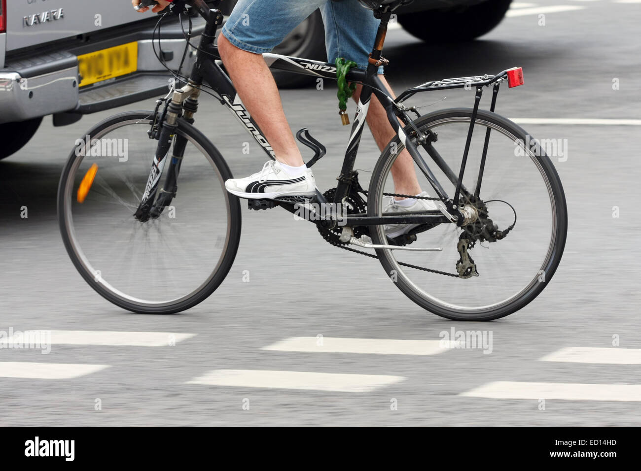 Male cyclist car behind on hi-res stock photography and images - Alamy