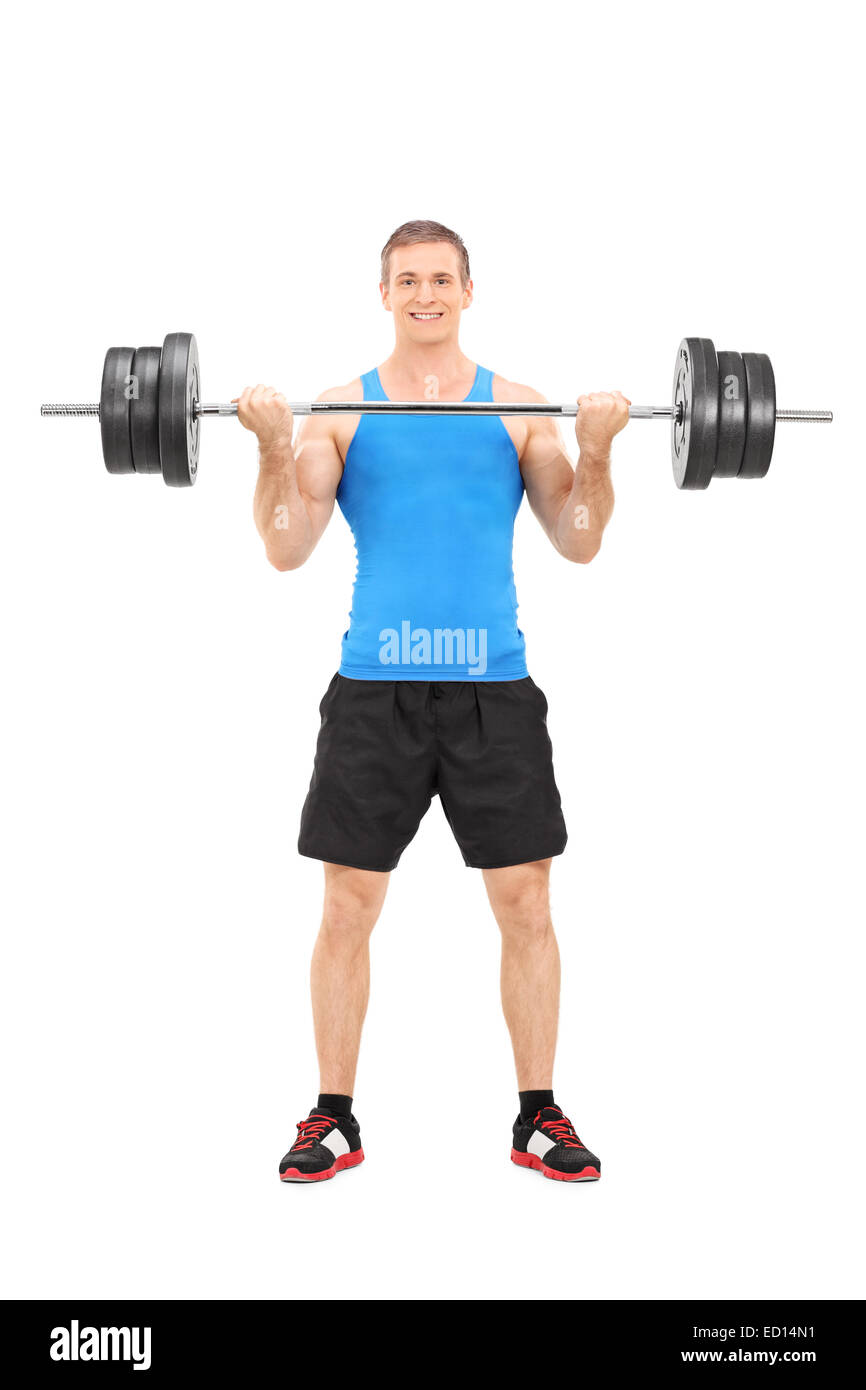 Full length portrait of a male bodybuilding lifting a barbell isolated ...