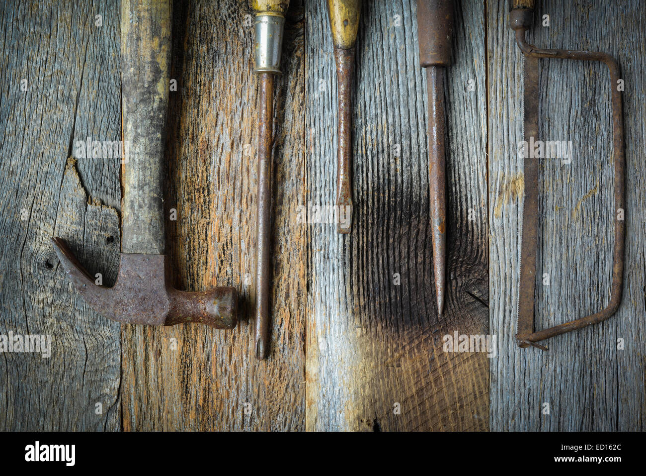 Hammer and screwdrivers on rustic wood background hi-res stock ...