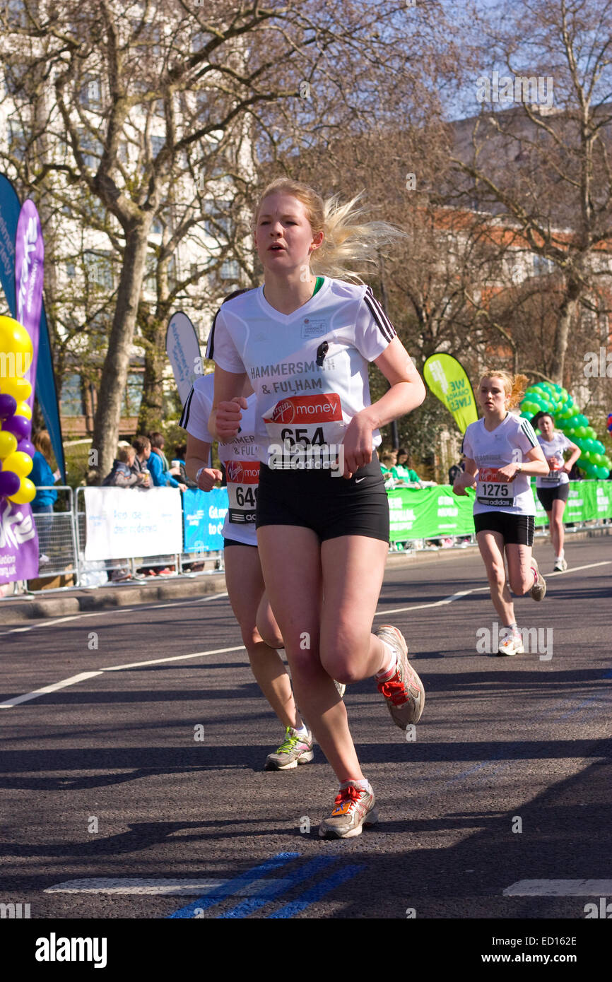 LONDON - APRIL 13: Unidentified girls run the London marathon on April ...