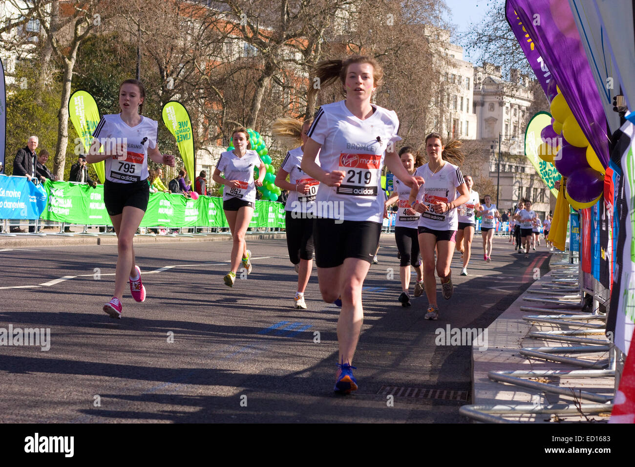 LONDON - APRIL 13: Unidentified girls run the London marathon on April ...