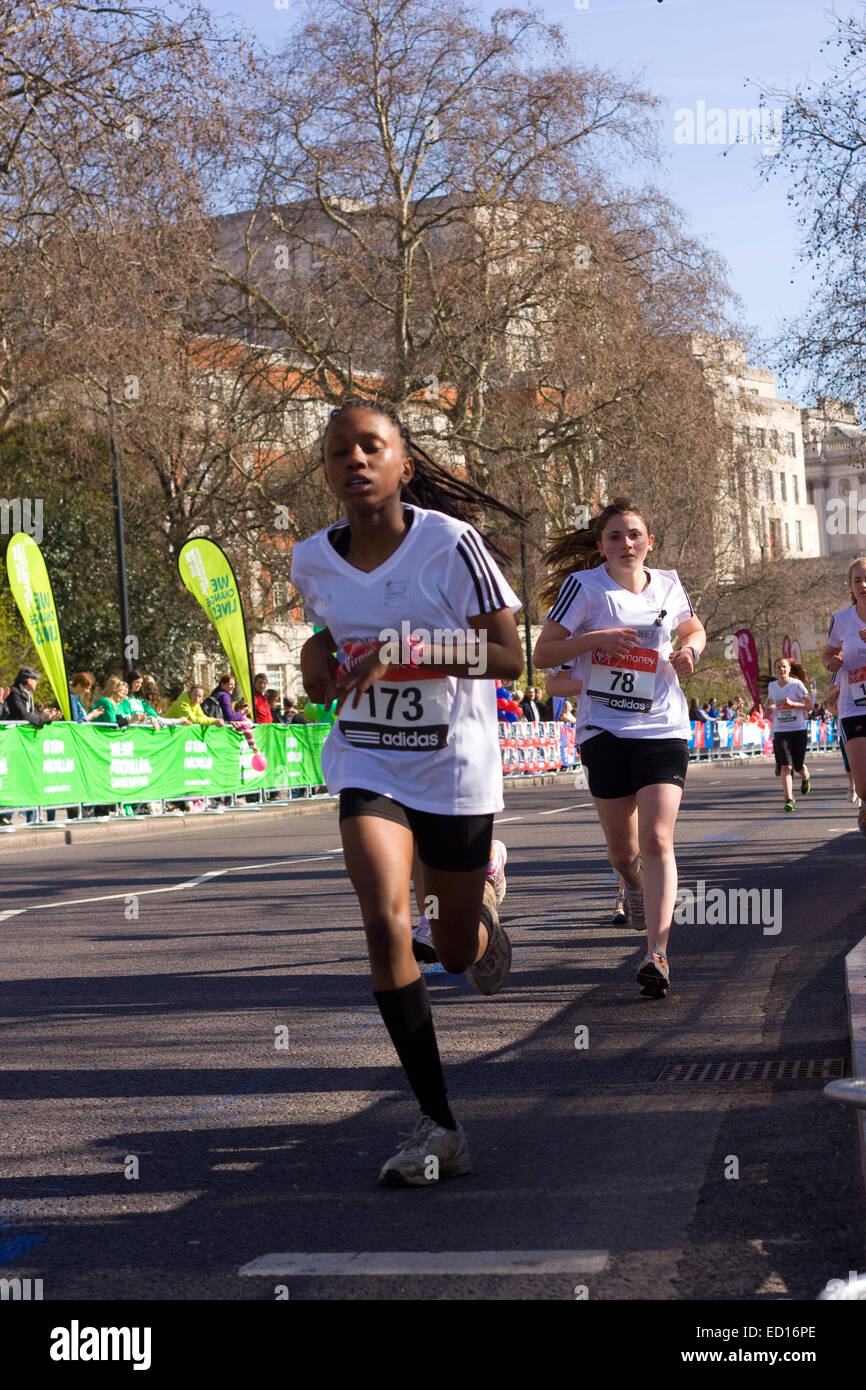 LONDON - APRIL 13: Unidentified girls run the London marathon on April ...