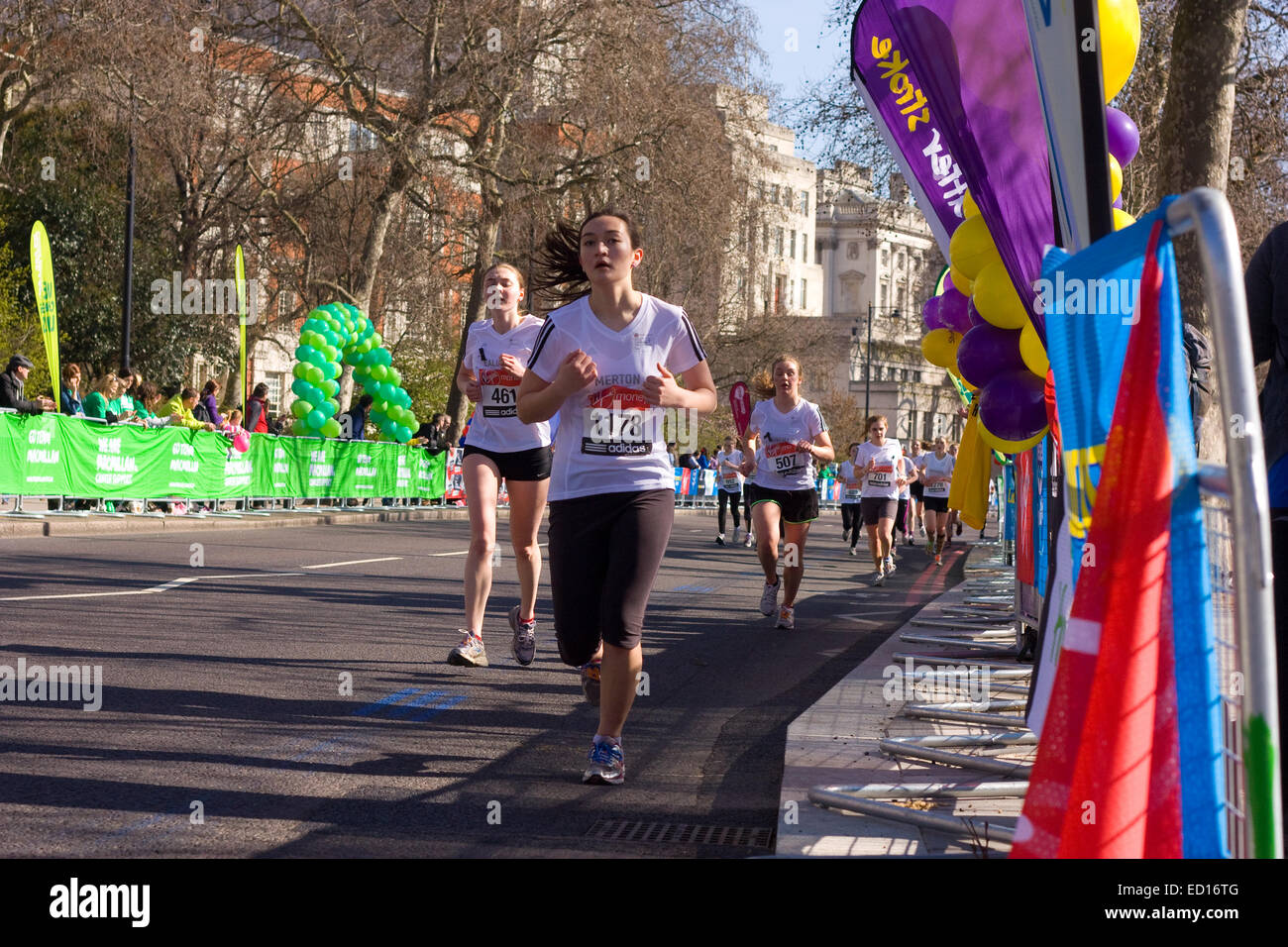 LONDON - APRIL 13: Unidentified girls run the London marathon on April ...