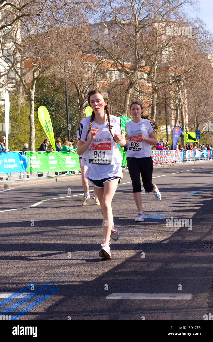 LONDON - APRIL 13: Unidentified girls run the London marathon on April ...