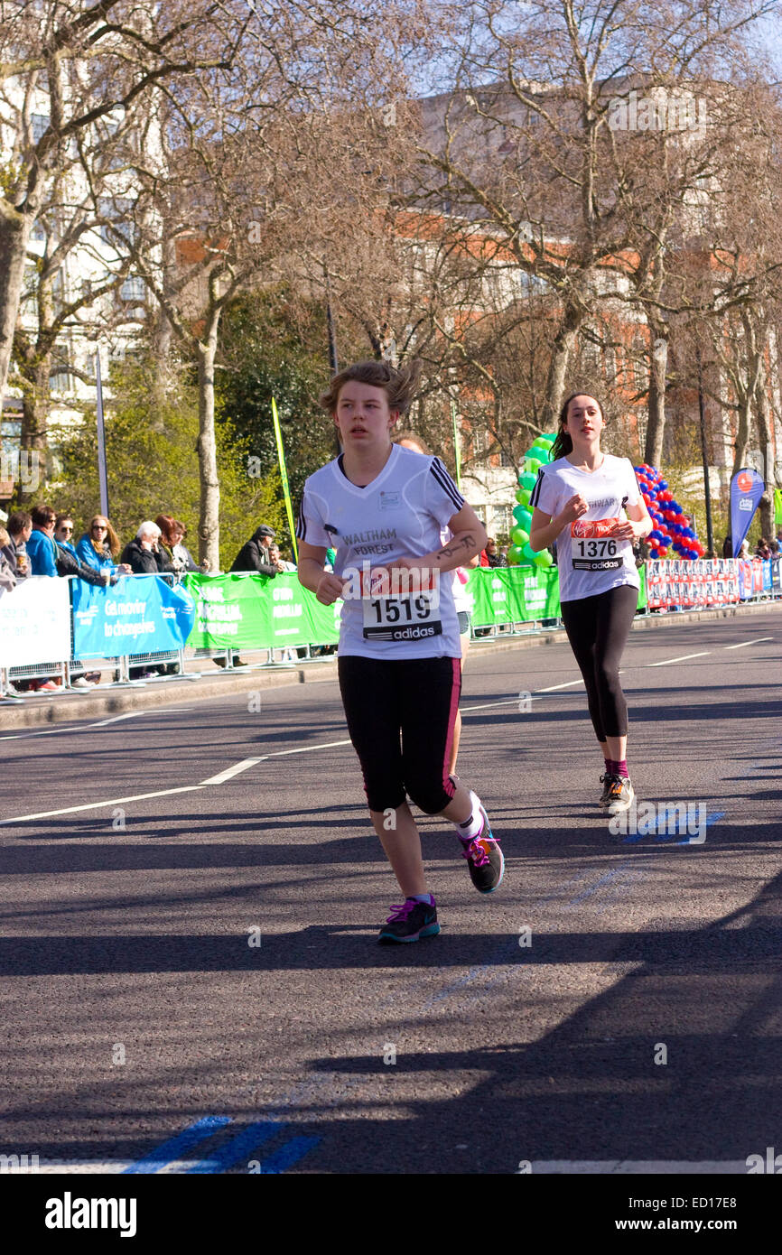 LONDON - APRIL 13: Unidentified girls run the London marathon on April ...