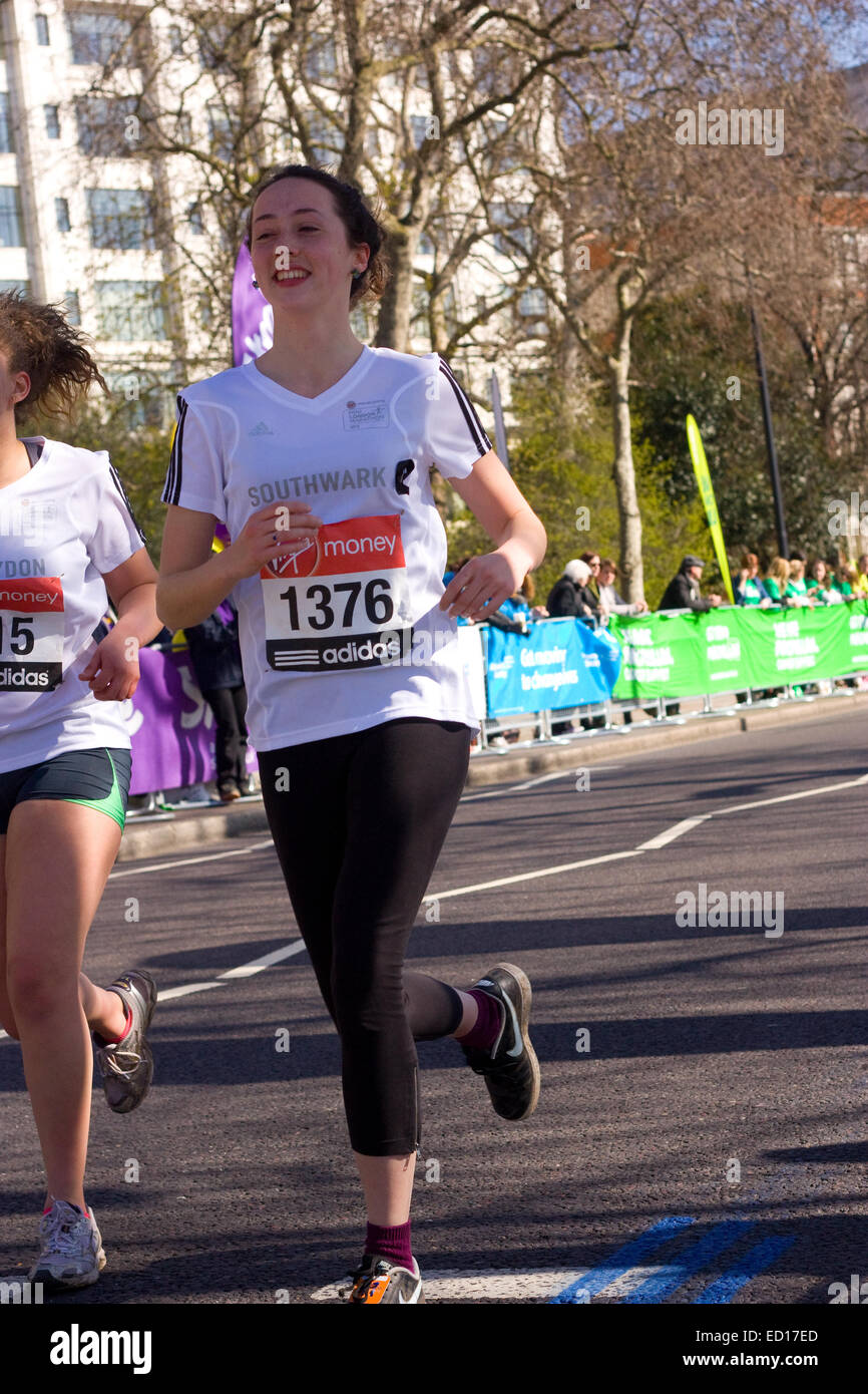 LONDON - APRIL 13: Unidentified girls run the London marathon on April ...