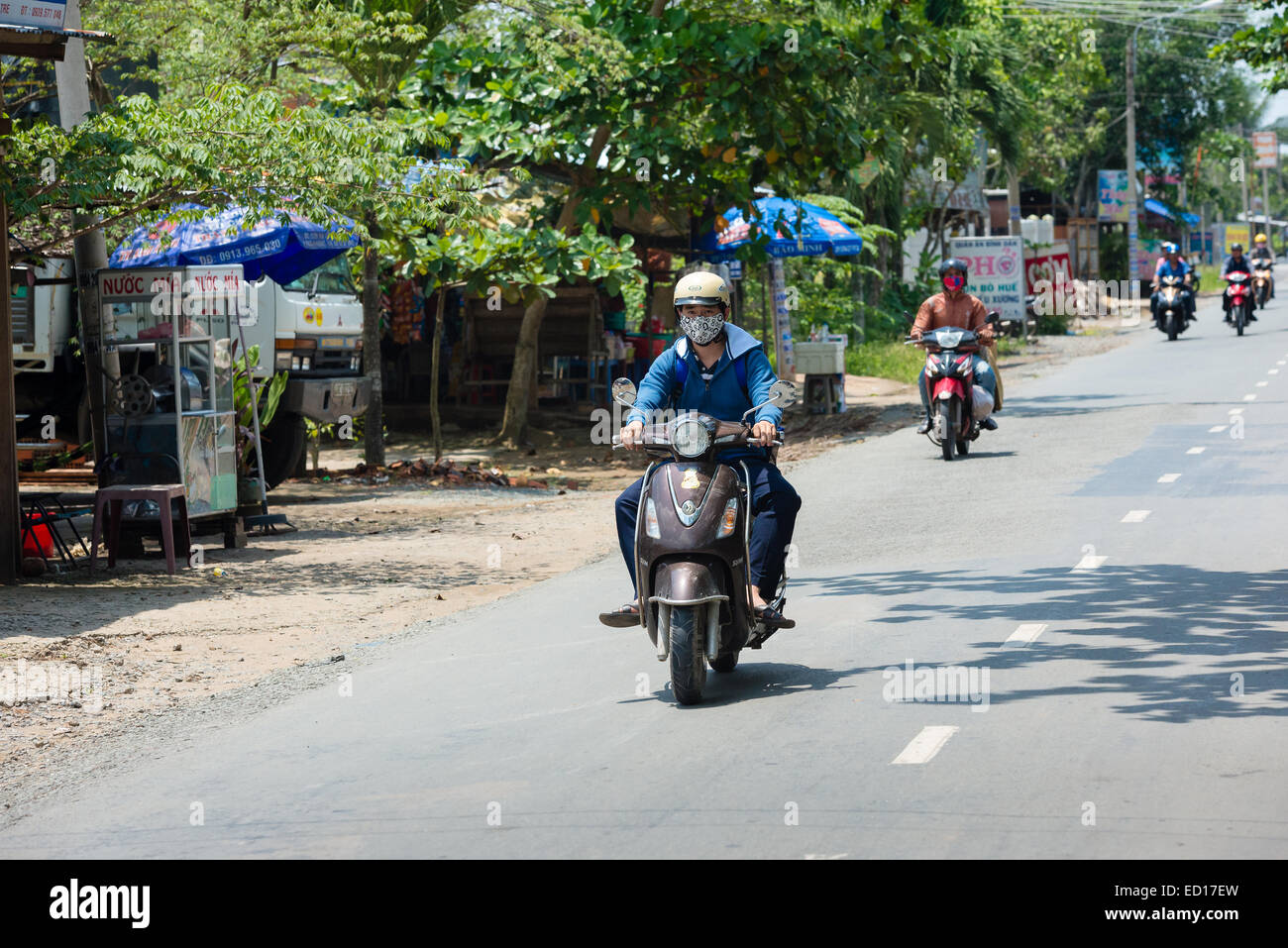 Vietnamese man riding motorcycle hi-res stock photography and images ...