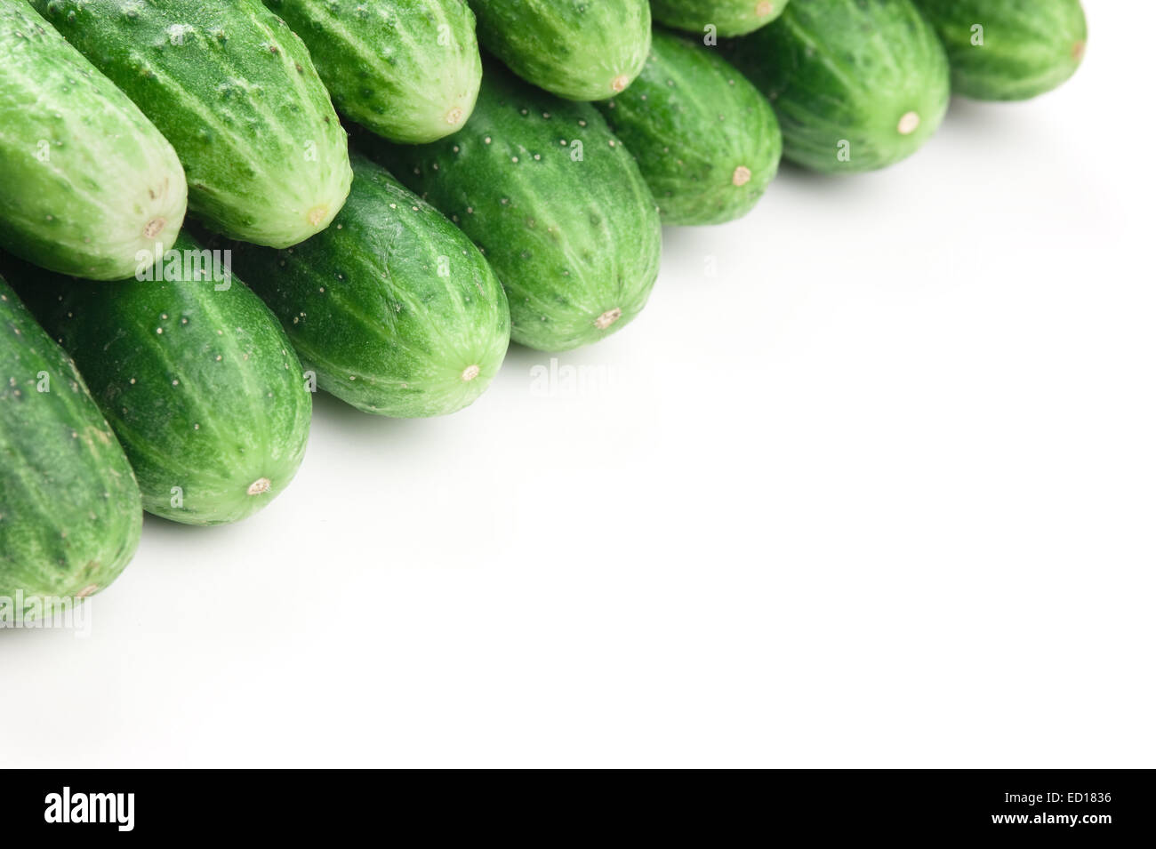 bunch of cucumbers isolated on white background Stock Photo - Alamy