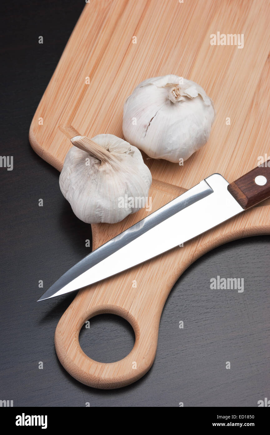 Kitchen knife with clove of garlic hi-res stock photography and images ...