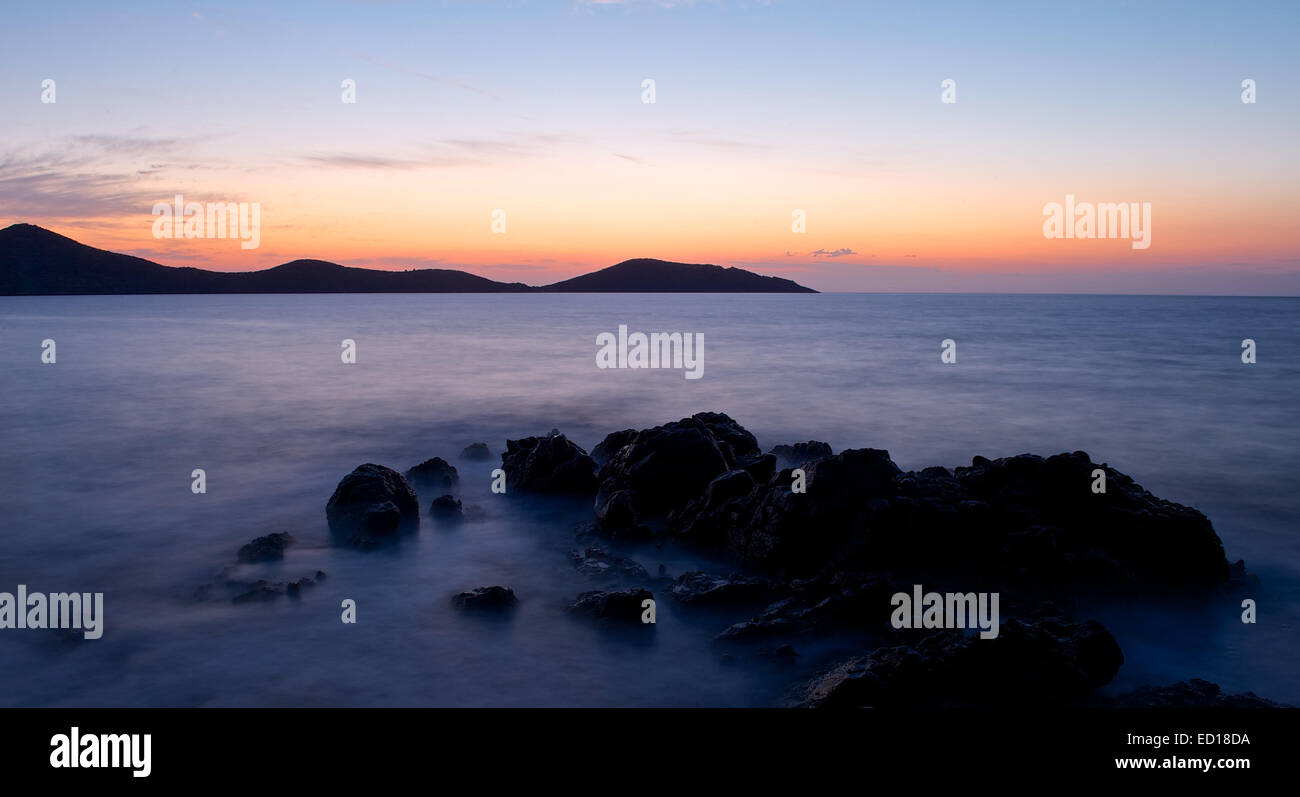 Horizontal sunset landscape of the island of Crete rocky fog covered ...