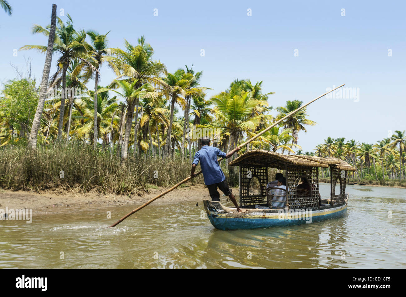Kerala, India - Poovar. Coconut grove canals tourist boat trip at ...