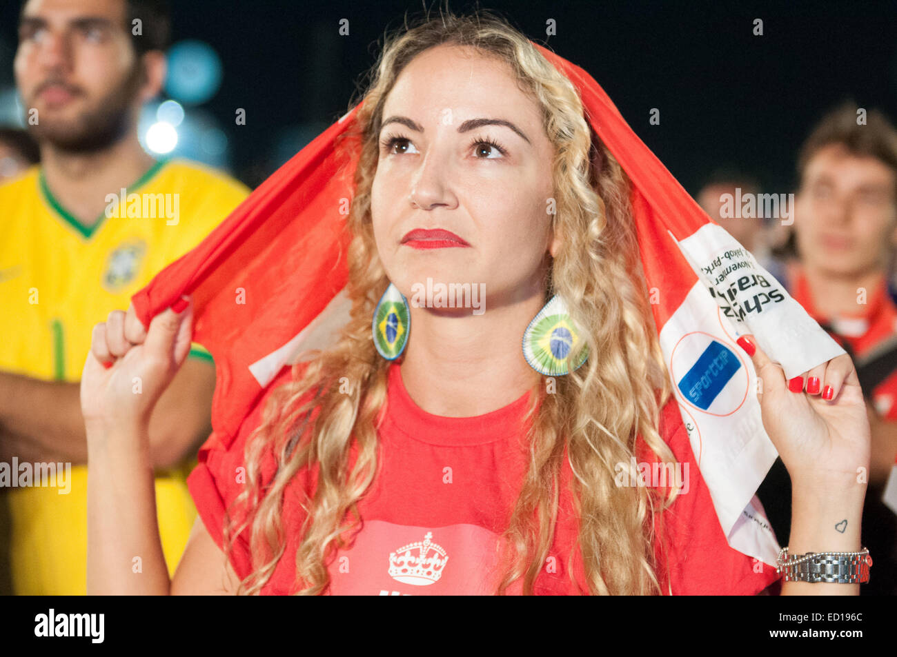 Fans at FIFA Fan Fest Rio de Janeiro watch the televised Group E match ...
