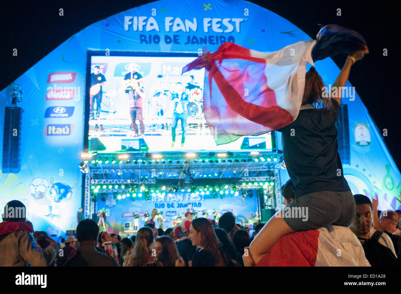 Fans at FIFA Fan Fest Rio de Janeiro watch the televised Group E match ...