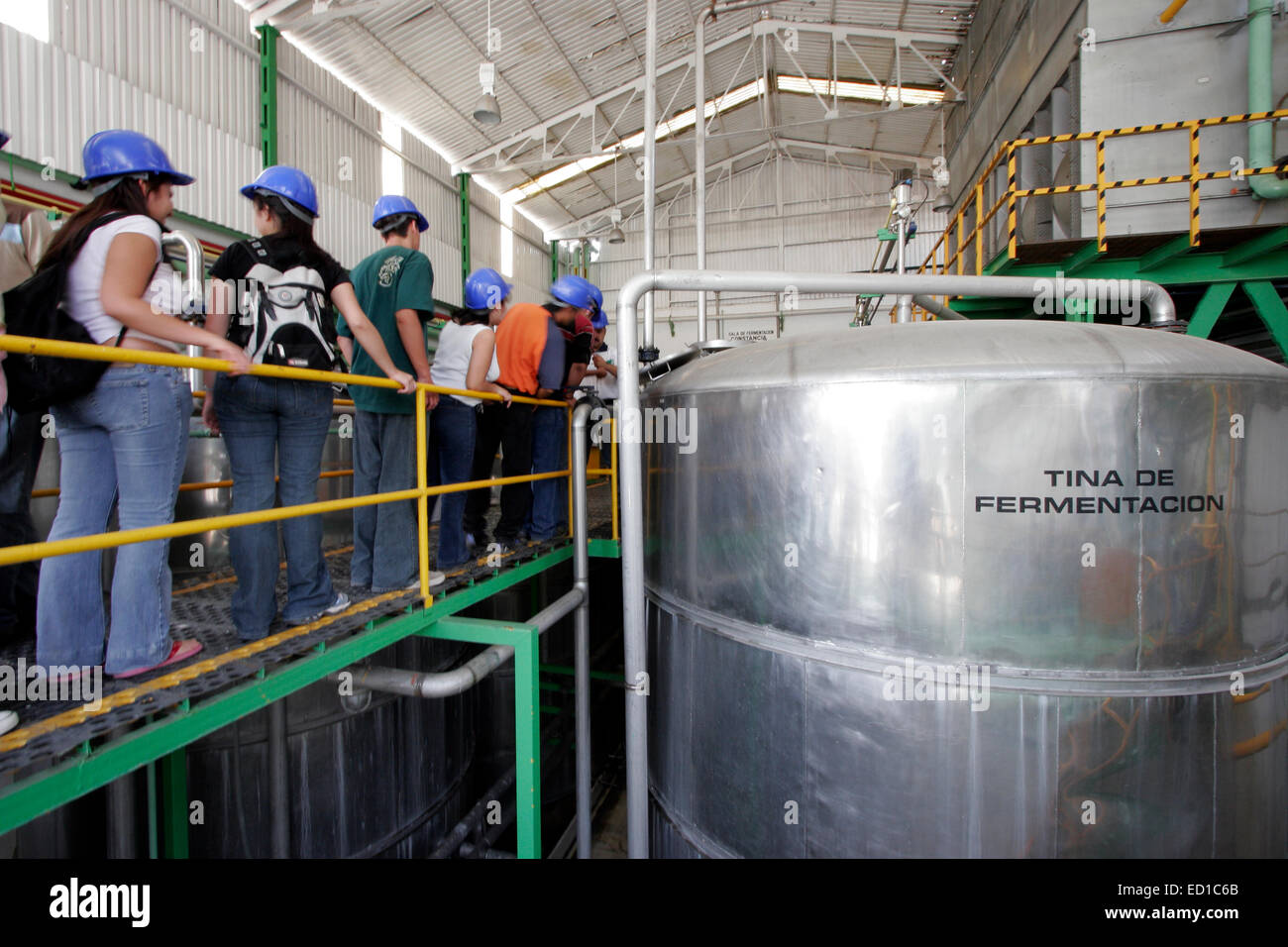 Visitors view one of the 20,000 liter fermentation tanks at Sauza's La ...