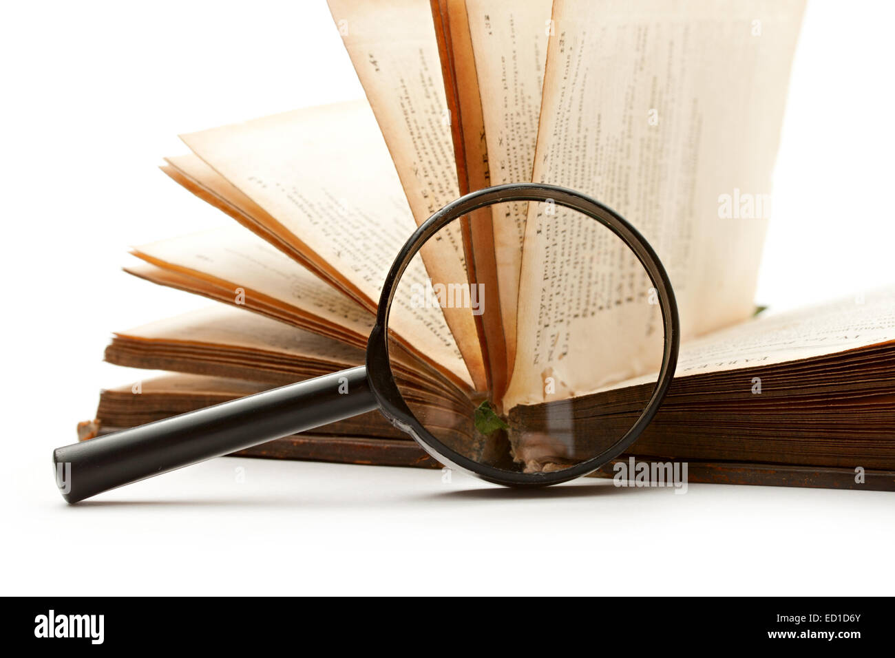 Magnifying glass and book isolated on white Stock Photo - Alamy