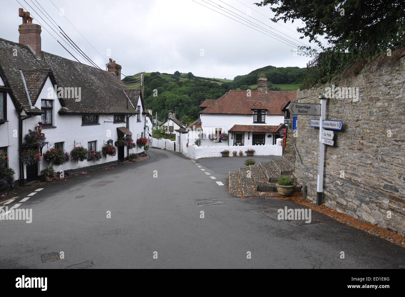 Centre of village of Combe Martin, north Devon with thatched cottages ...