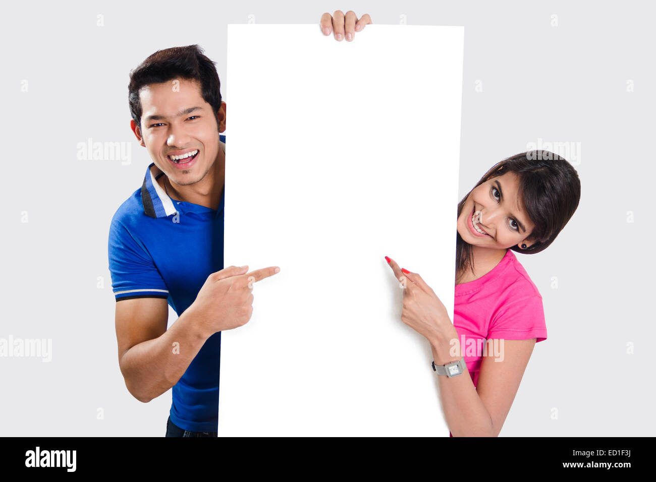 2 indian Beautiful Couple showing Message Board Stock Photo - Alamy