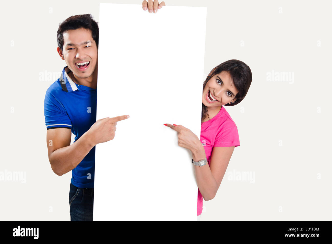 2 indian Beautiful Couple showing Message Board Stock Photo - Alamy