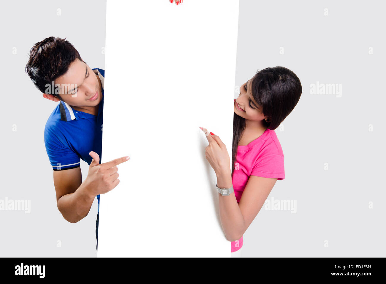 2 indian Beautiful Couple showing Message Board Stock Photo - Alamy