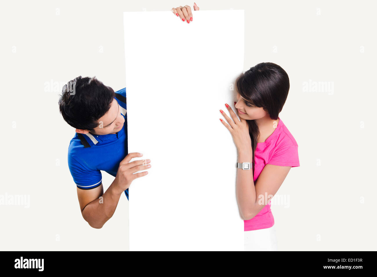 2 indian Beautiful Couple showing Message Board Stock Photo - Alamy