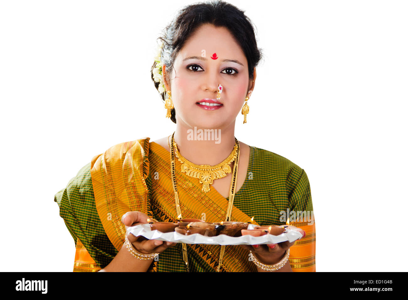 South indian woman holding pooja hi-res stock photography and images ...