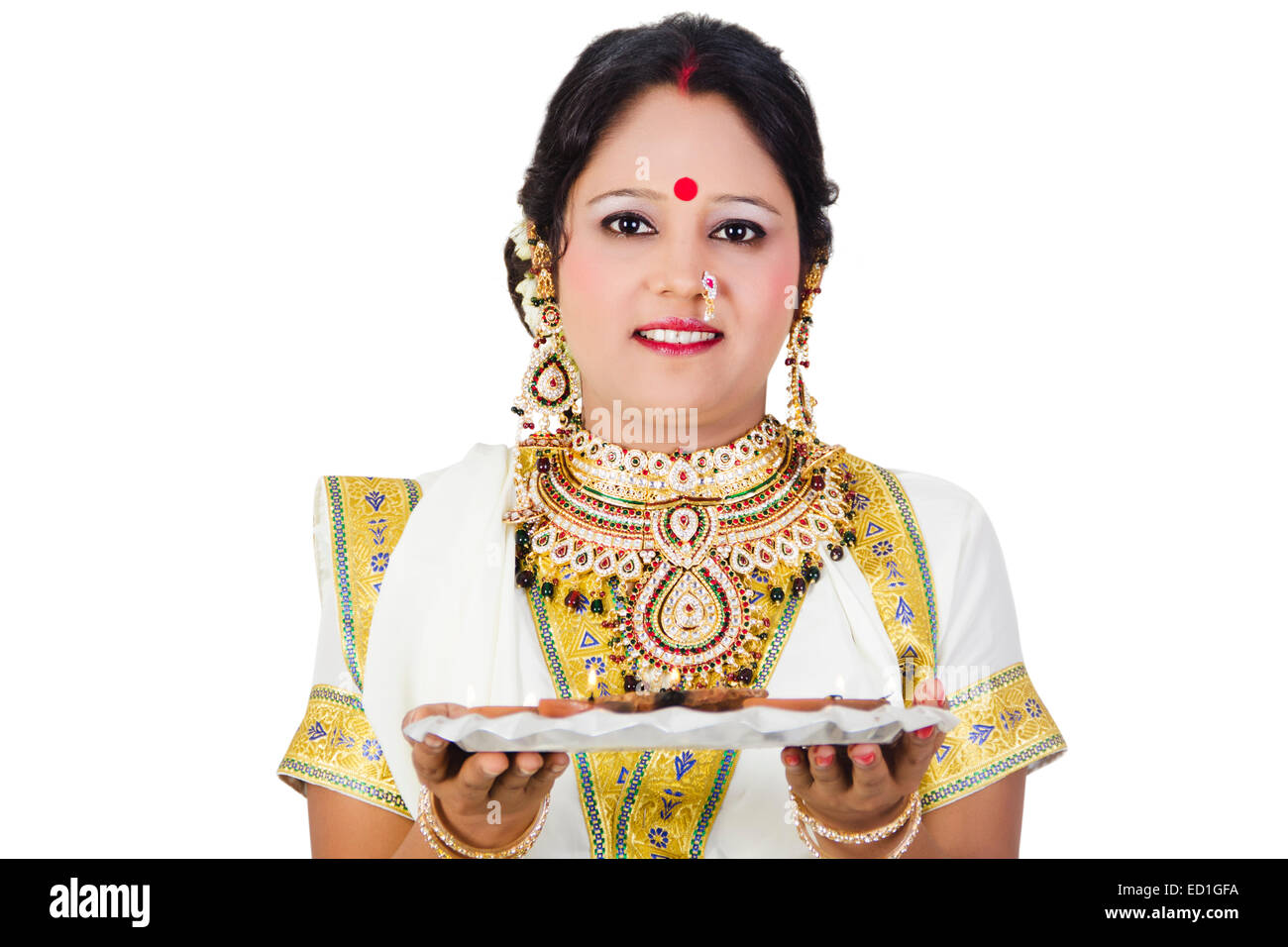 South indian woman holding pooja hi-res stock photography and images ...