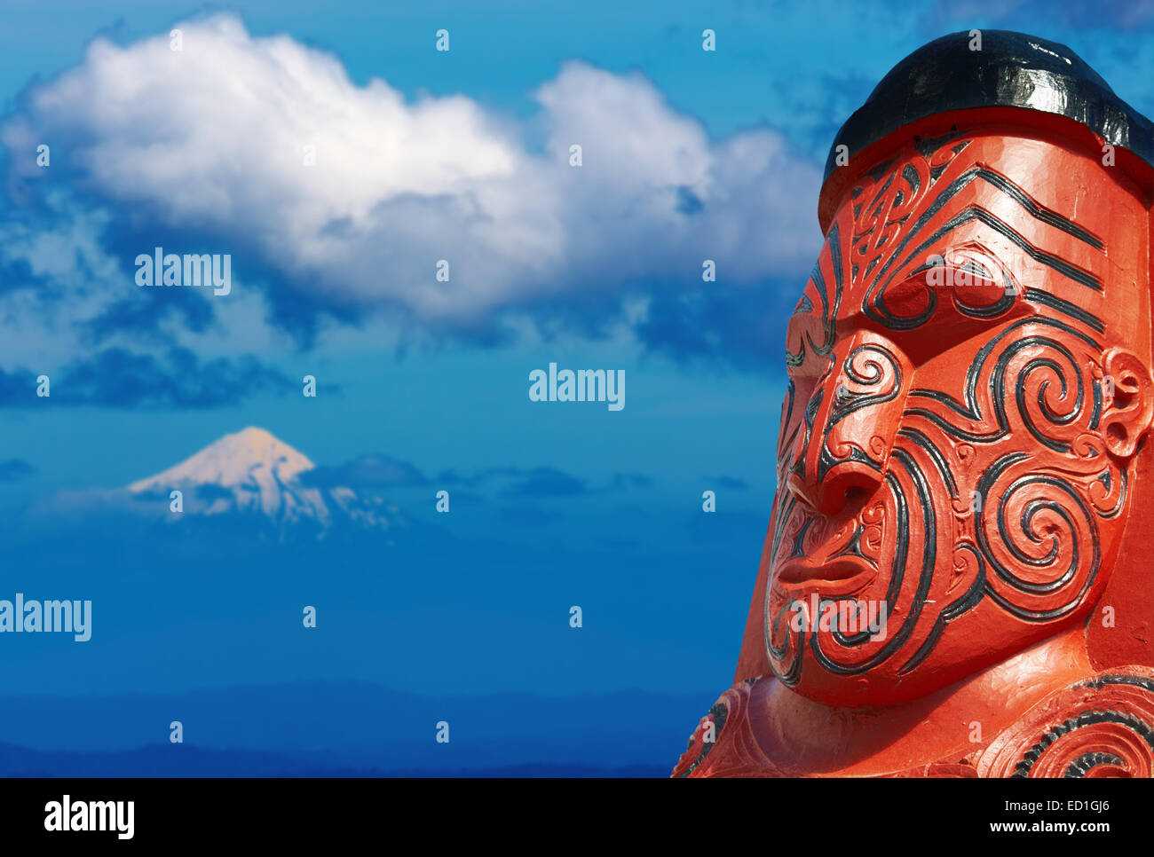 Traditional maori carving and Taranaki Mount, New Zealand Stock Photo ...