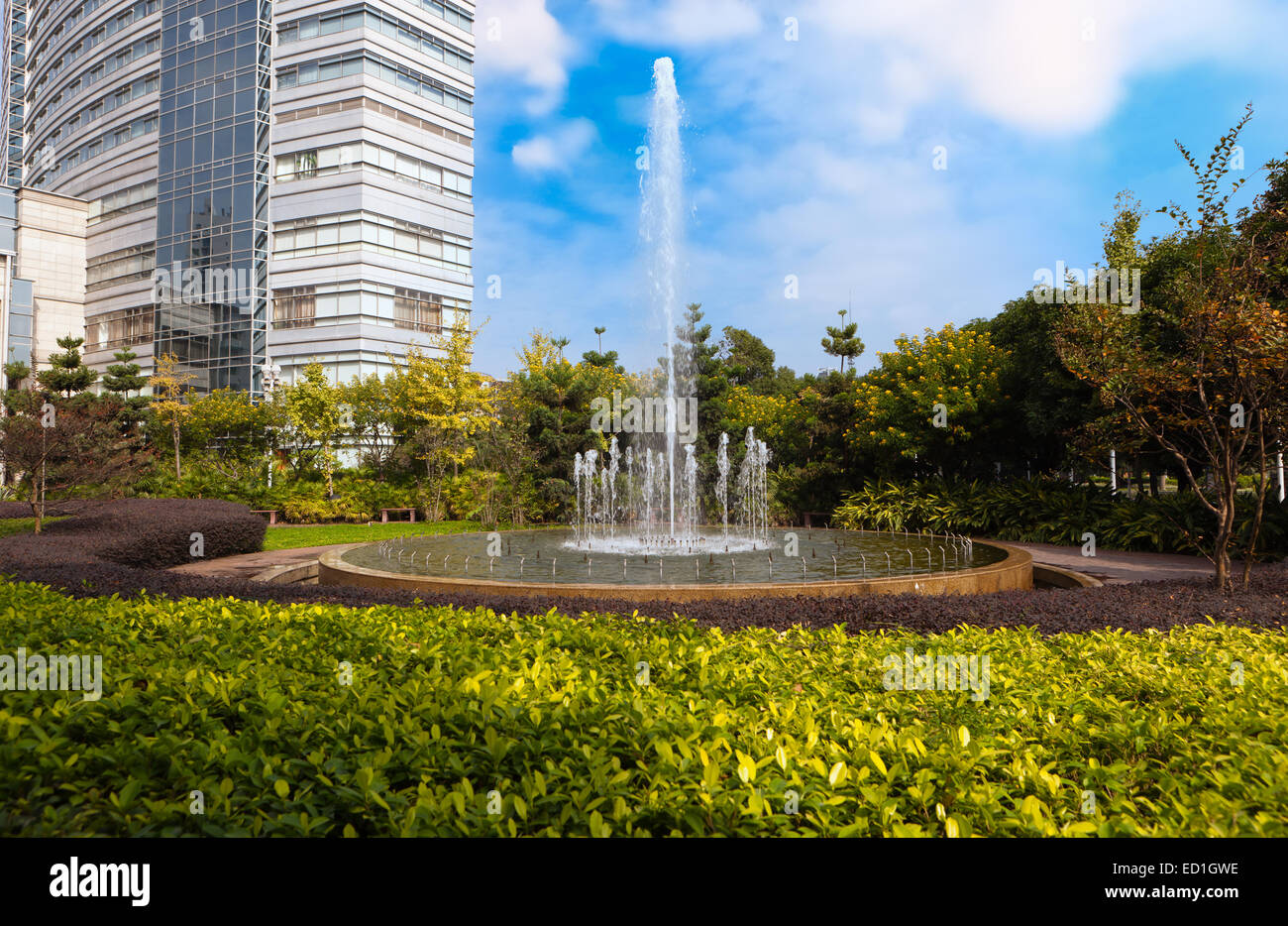 Beautiful Multi-jet fountain in Garden with building and sky in the ...