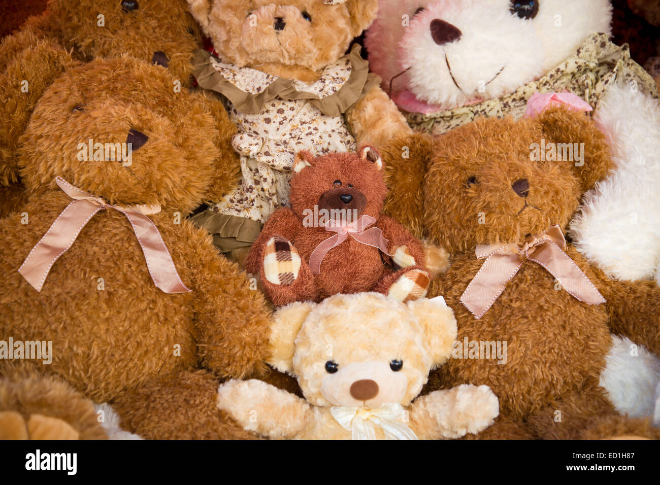 A stack of stuffed toy bear in a very fortunate child's bedroom,gifts ...