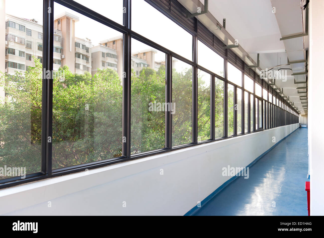 Long hallway and outside scene viewed from building Stock Photo - Alamy