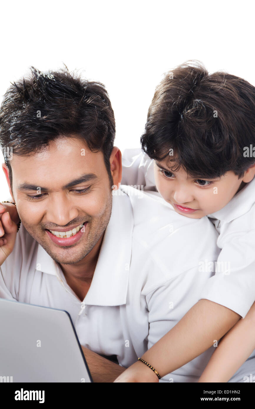indian father with child enjoy Watching laptop Stock Photo - Alamy