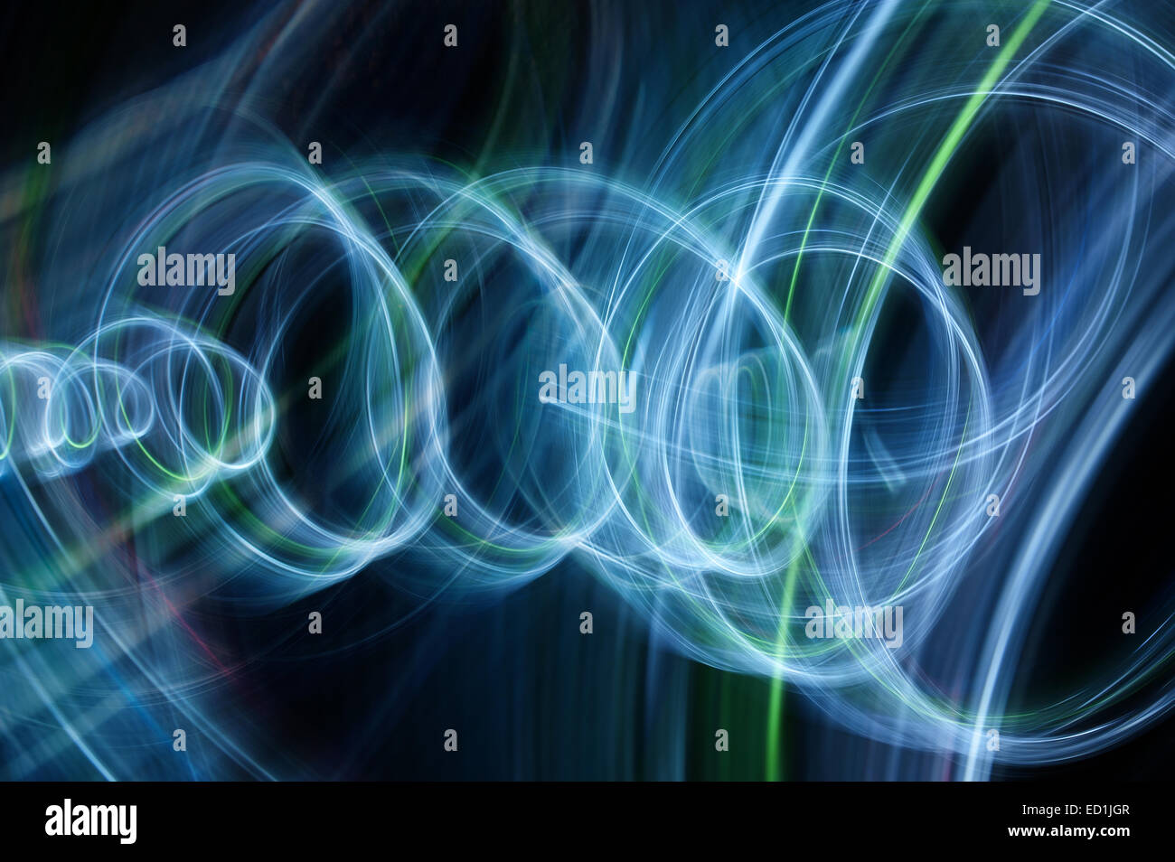 swirling spinning motion and trails traces of moving lights creating ...